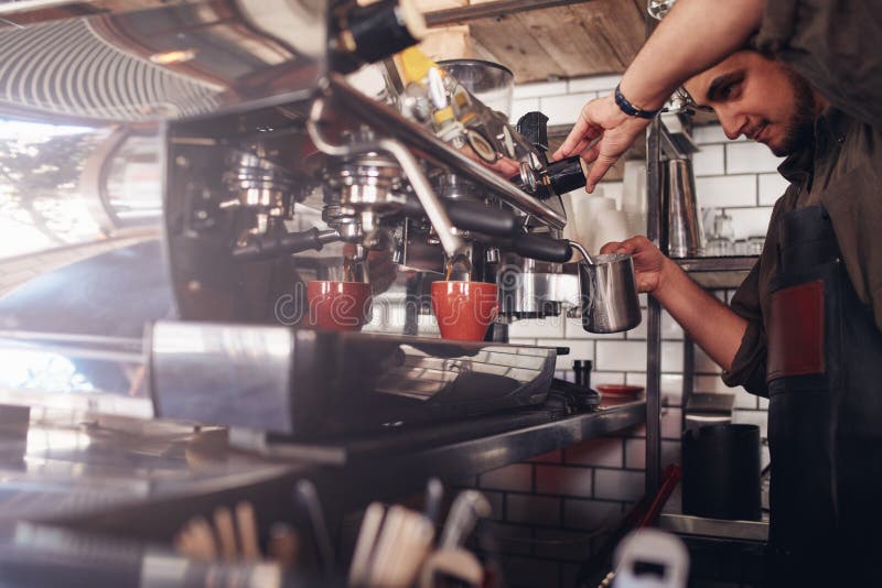 Barista Using Coffee Maker To Make a Cup of Coffee Stock Image - Image ...