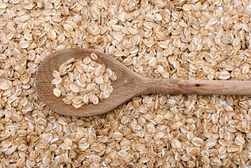Barley Flakes on Wooden Spoon Stock Photo - Image of wheat, oatmeal ...