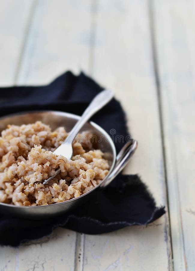 Barley groats in a plate stock image. Image of detail - 34479711