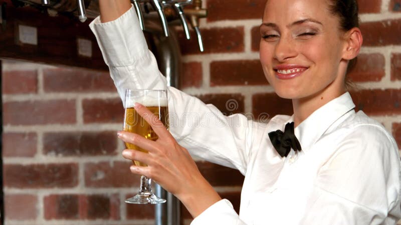 Pretty Barmaid Pouring Beer in a Glass Stock Footage - Video of glass ...