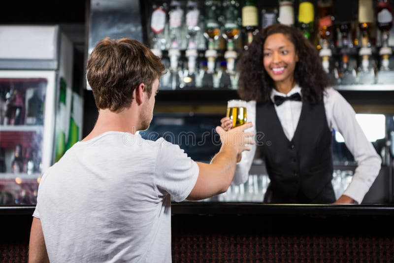 Barmaid Serving Beer To Man Stock Image - Image of alcoholic, indoors ...