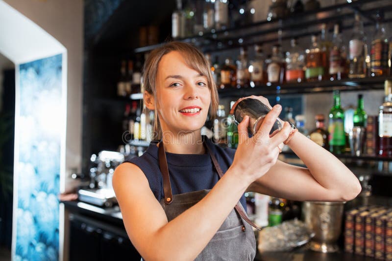 Barmaid with Shaker Preparing Cocktail at Bar Stock Image - Image of ...