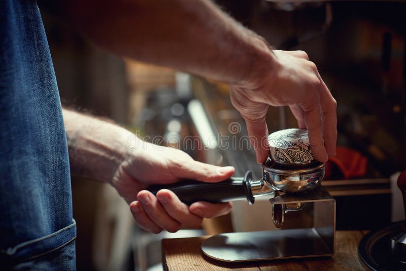 A Barman Behind the Bar is Preparing an Espresso Beverage. Coffee ...