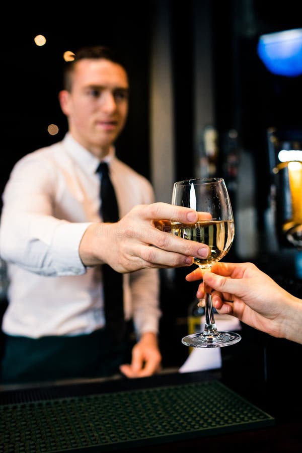 Barman Giving a Drink To Customer Stock Photo - Image of bartender ...