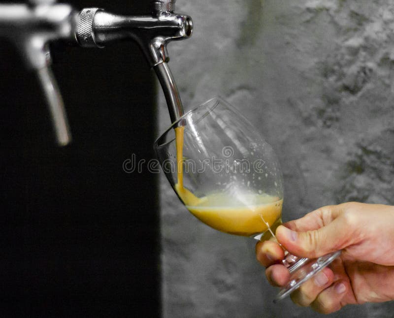 Barman Hand at Beer Tap Pouring a Draught Beer in Glass Serving Stock ...