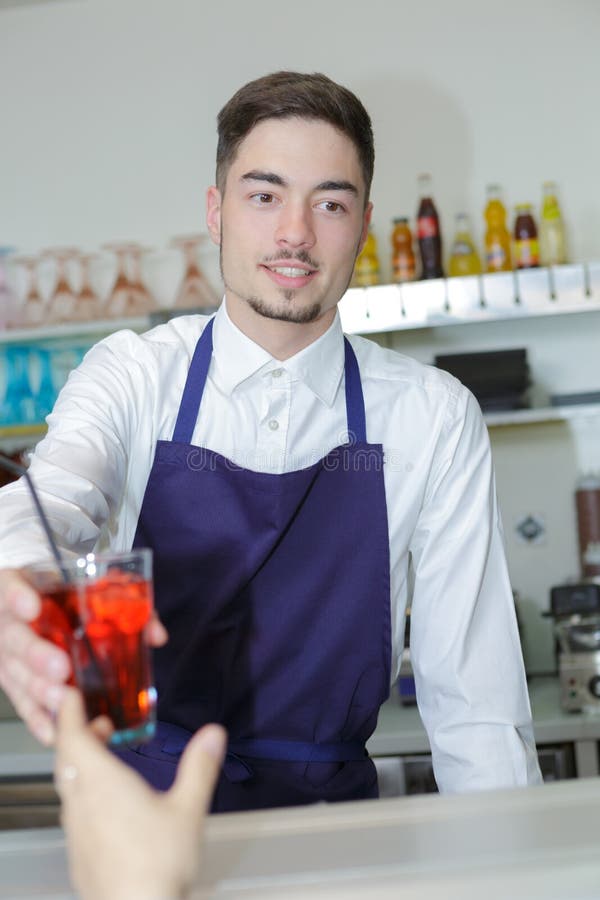 Barman Passing Drink To Customer Stock Image - Image of caucasian, slim ...