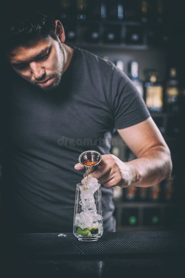 Barman prepares a cocktail stock image. Image of bartender - 90634737