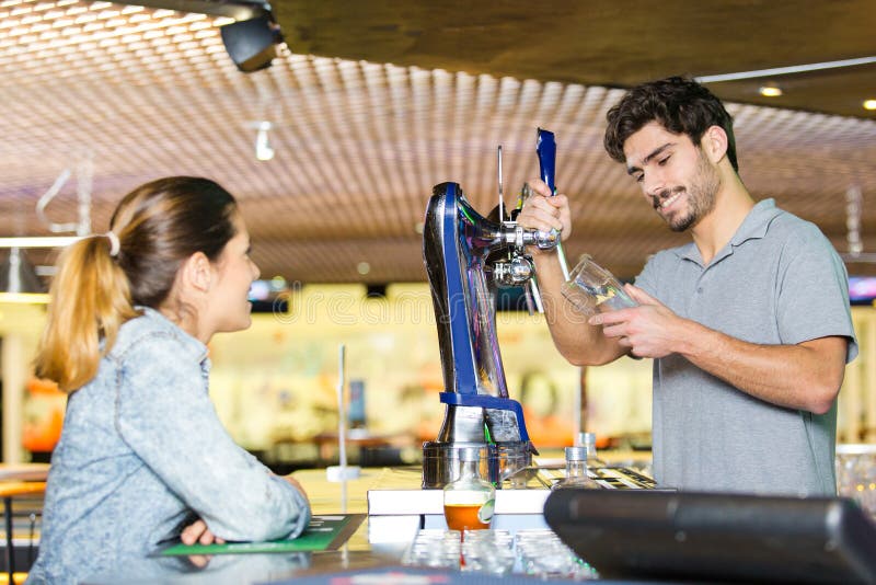 Female Bartender Serving Beer Male Customer Stock Photos - Free ...