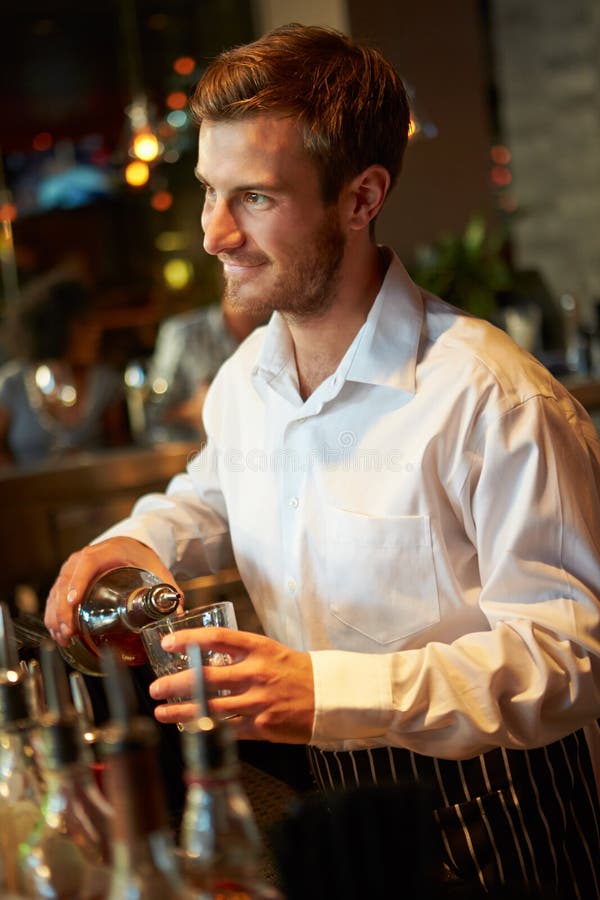 Barman Serving Drinks in Nightclub Stock Photo - Image of laughing ...