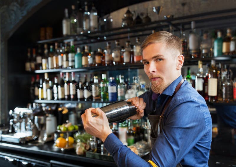 Barman with Shaker Preparing Cocktail at Bar Stock Photo - Image of ...