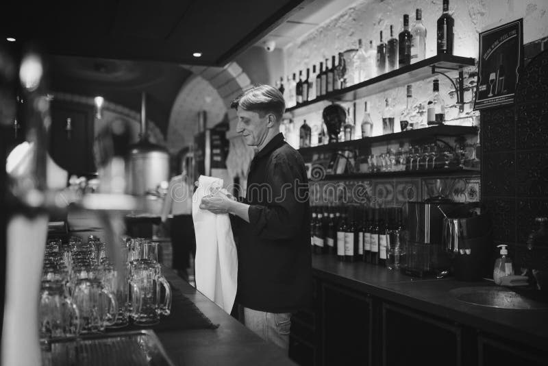 Barman at work in the pub stock image. Image of bartender - 75158615