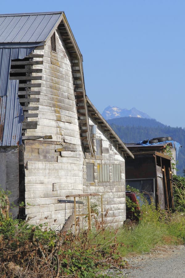 Barn Facade and Mountain stock photo. Image of paint - 75822696