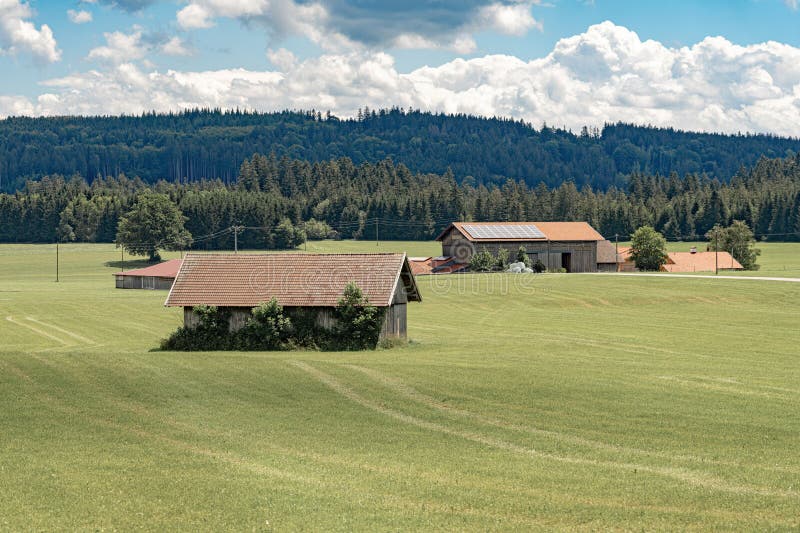 A Barn, a House in a Field in the Countryside Against the Backdrop of a ...