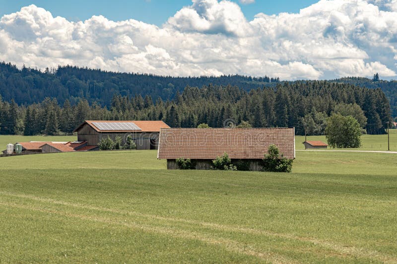 A Barn, a House in a Field in the Countryside Against the Backdrop of a ...