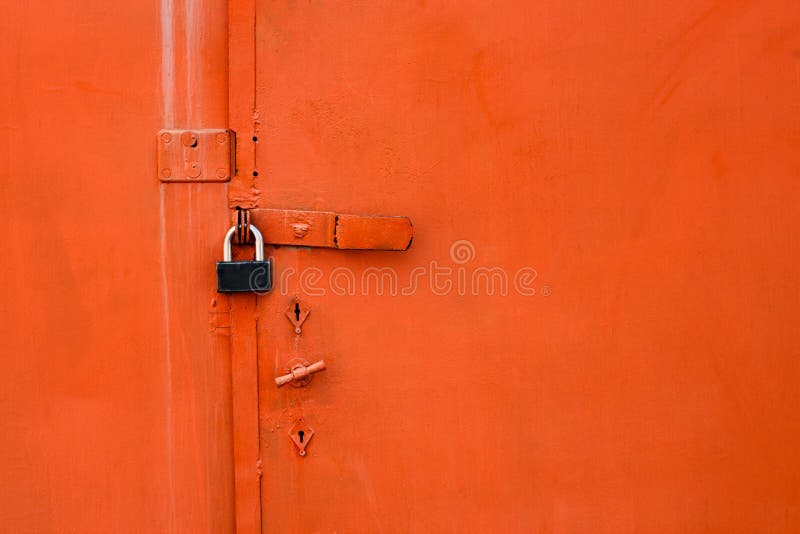 Barn Lock on the Gate. Orange Old Metal Garage Gate Locked with a Barn ...
