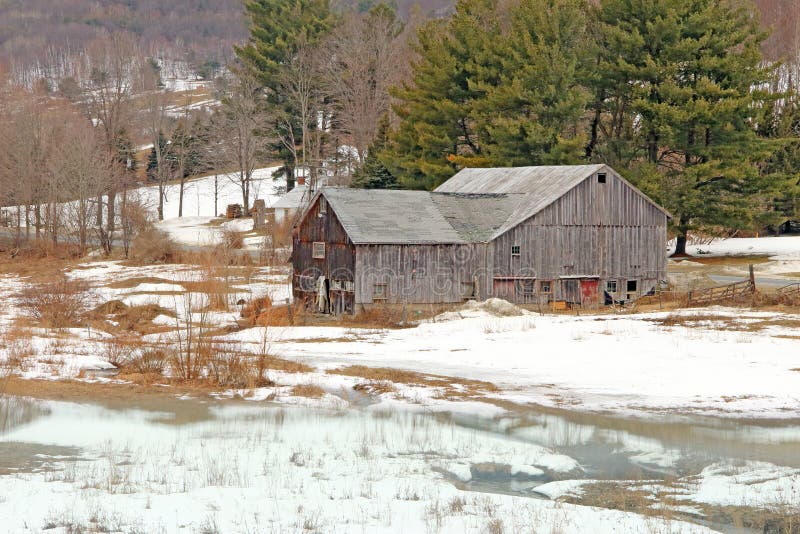 Barn in Winter Snow with Iced Over Puddles Upstate New York Stock Photo ...