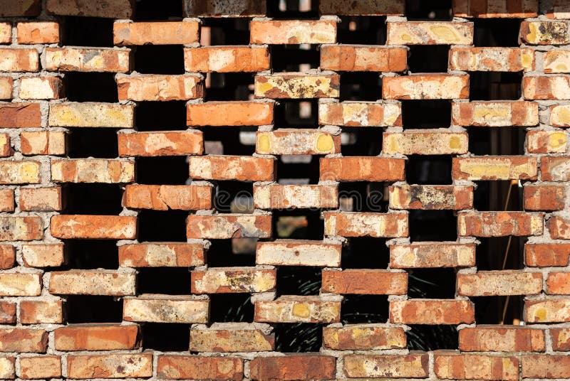 A Barn Wall Made of Red Bricks with Large Square Holes Stock Image ...