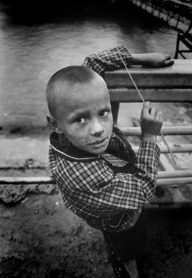 Barnaul, Russia-August 5, 2000. Homeless Boy Asks for Alms from Passers ...