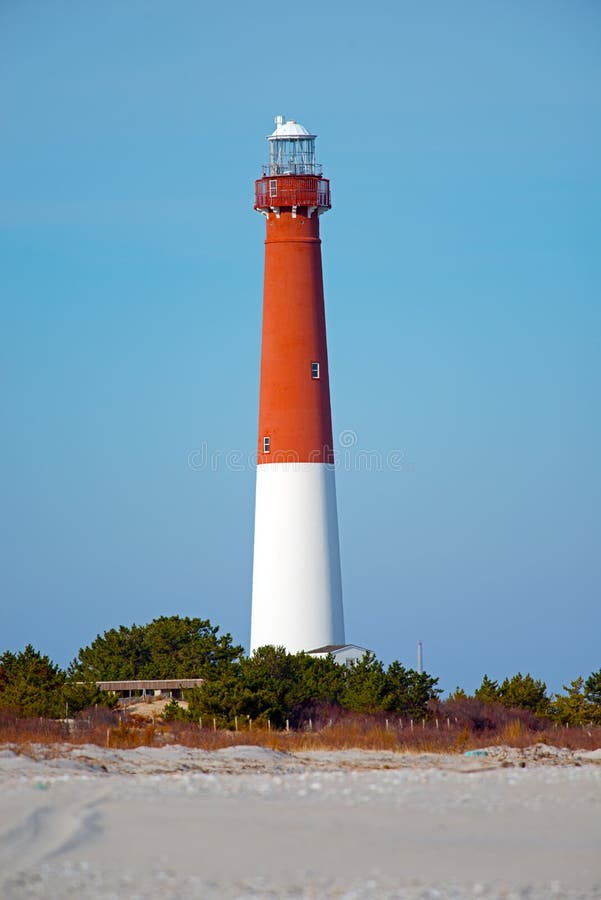 Barnegat Lighthouse at Dusk Stock Photo - Image of lighthouse, sail ...
