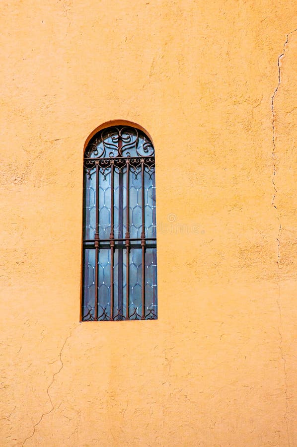 Barred, Tall, Window,set in, Gold Tone, Concrete Wall Stock Photo ...