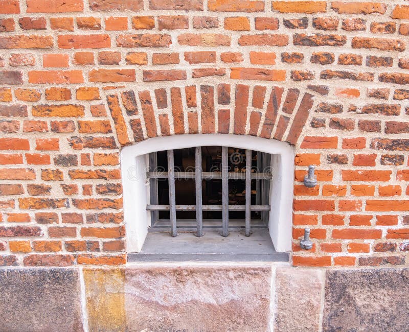 Barred Window in Brick Wall Stock Photo - Image of brickwork, window ...