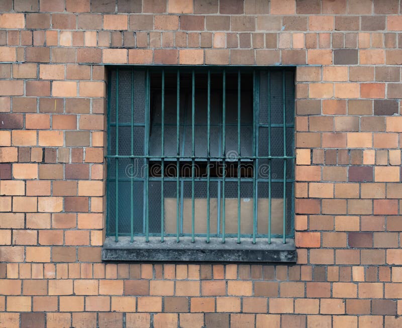Barred Window in Brick Wall Stock Image - Image of metal, building ...