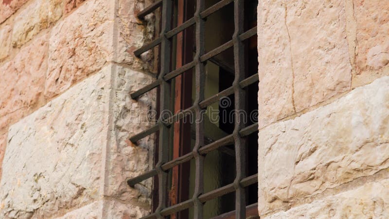 Barred Window of an Old Prison with a Rusty Iron Bars Close-up. Stock ...