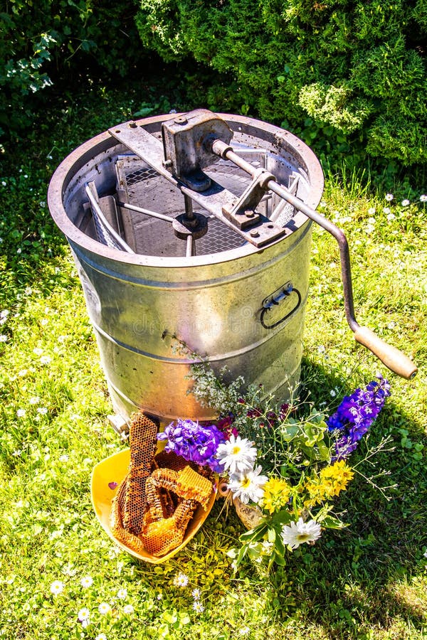 Barrel of Honey Extractor and with Honeycomb Next To it Stock Image ...
