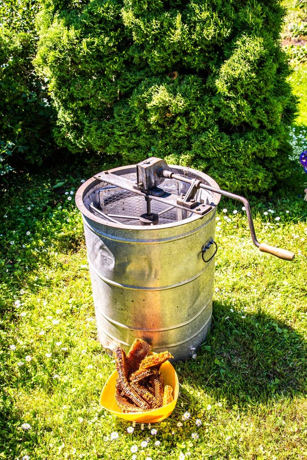 Barrel of Honey Extractor and with Honeycomb Next To it Stock Image ...