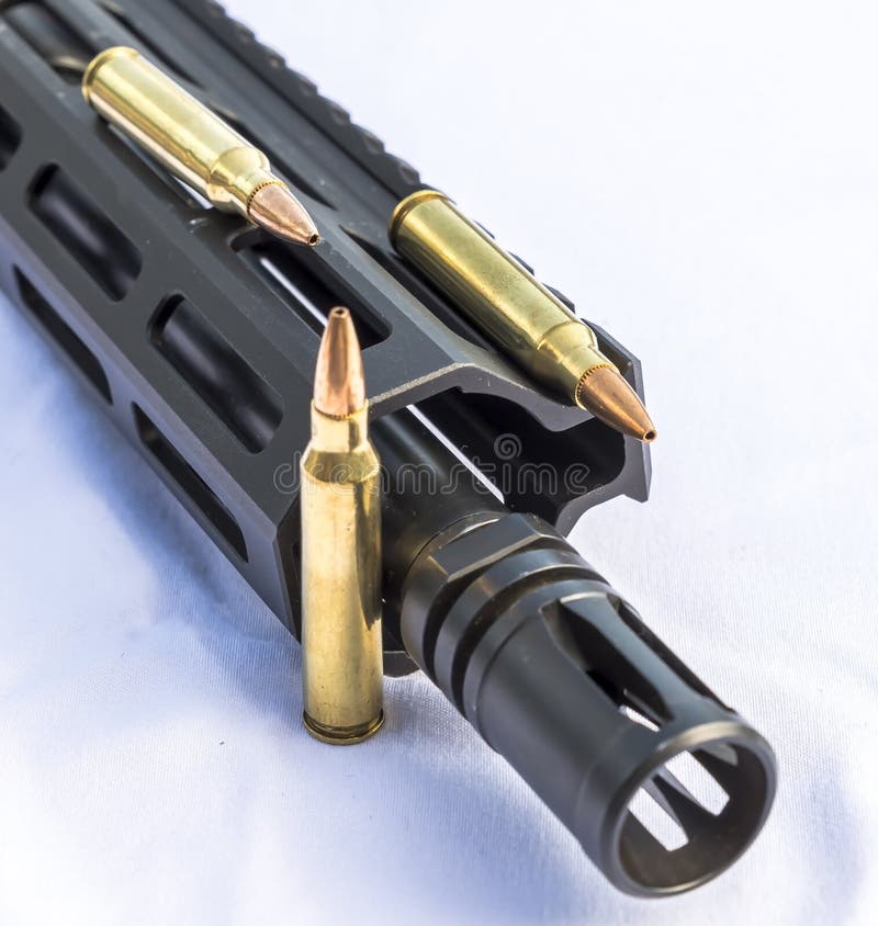 The Barrel and Muzzle of an AR 15 Rifle with Three 223 Caliber Bullets ...