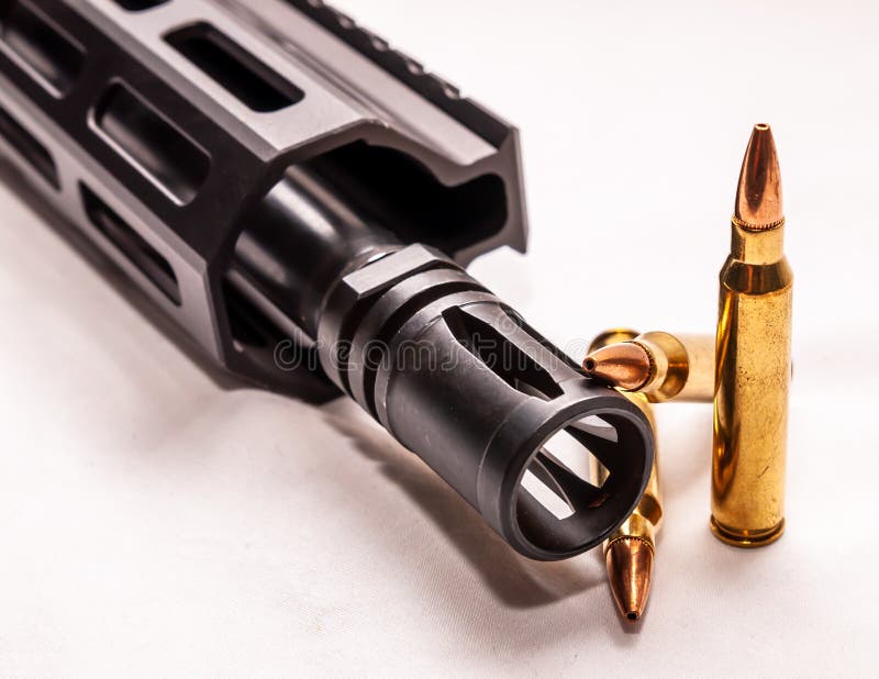 The Barrel and Muzzle of a 223 Caliber Rifle with Three Bullets for it ...