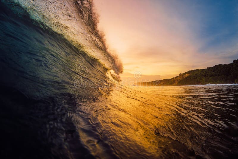 Barrel Wave Crashing in Ocean on Warm Sunset or Sunrise Stock Image ...