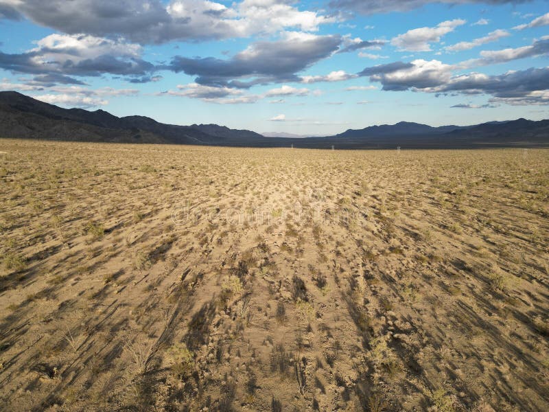 Barren Landscape Featuring a Dirt-covered Terrain, with Distant ...