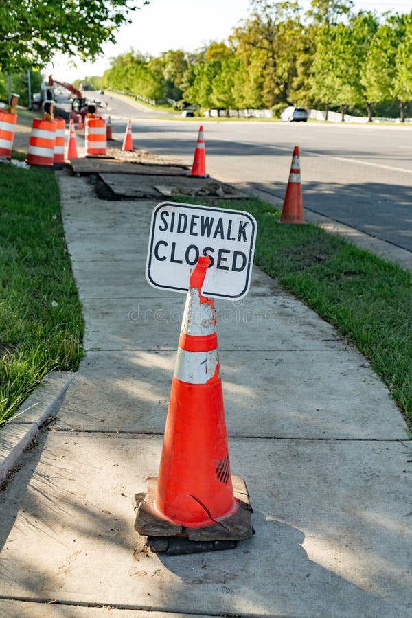Barrier Cone and the Sign SIDEWALK CLOSED. a Barrier on the Way in ...