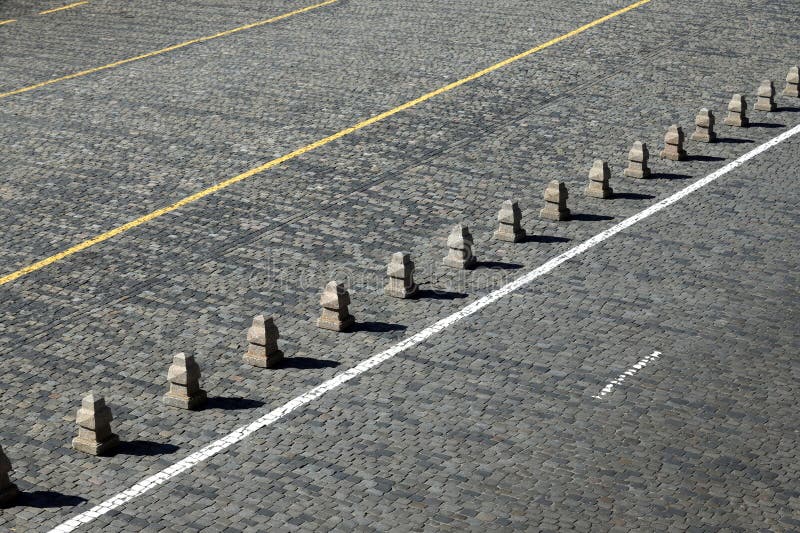 Barrier from Granite Pyramids after Long White Line on Street Paving ...