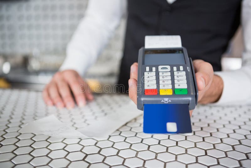 Bartender Accepting a Credit Card at Bar Counter Stock Image - Image of ...