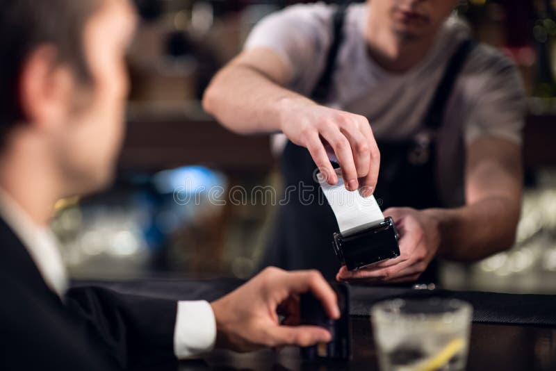 The Bartender Accepts Payment by Credit Card at the Bar Stock Image ...