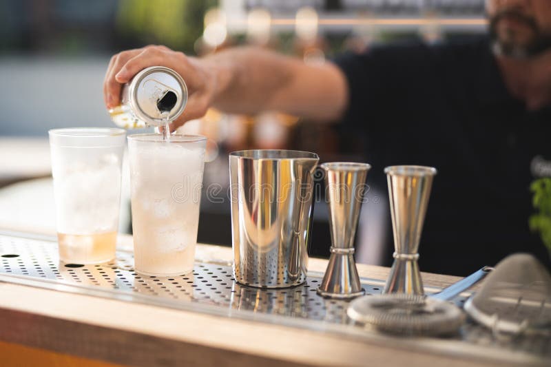 The Bartender Behind the Bar Makes an Alcoholic Cocktail Stock Image ...