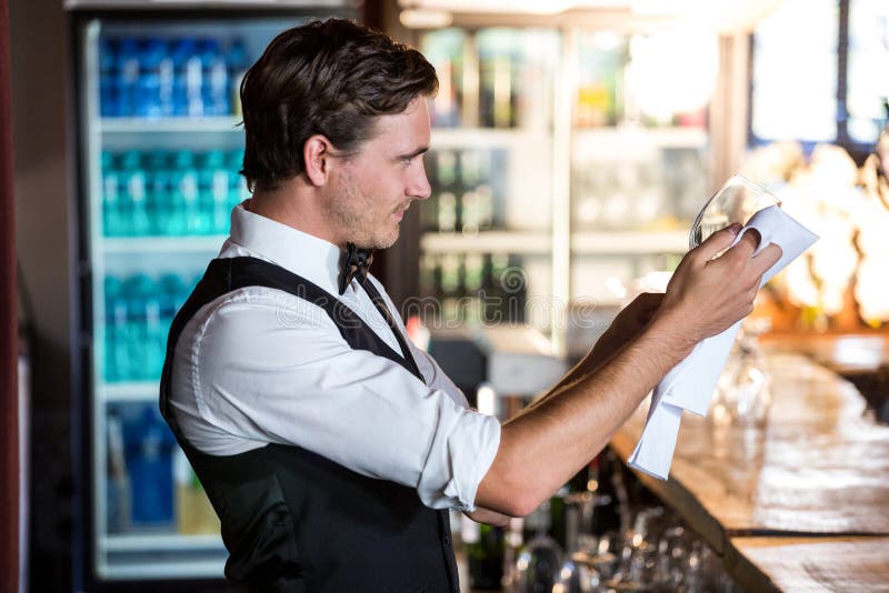 Bartender Cleaning Wineglass Stock Photo - Image of service, standing ...