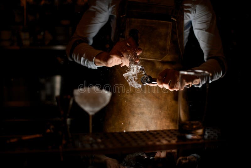 Bartender Crushing the Ice Cube with Picker Stock Photo - Image of ...