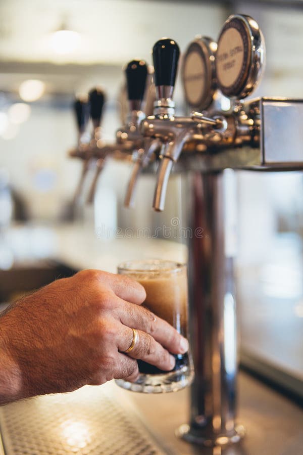 Bartender Hand Pouring Beer from a Tap Stock Image - Image of fresh ...