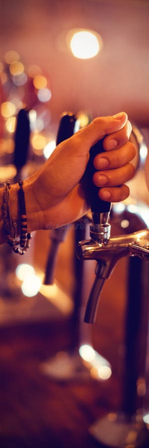 Bartender Hands Using Beer Tap in Pub Stock Photo - Image of people ...