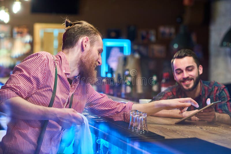 Bartender Helping Guest Choosing Drinks Stock Photo - Image of beard ...