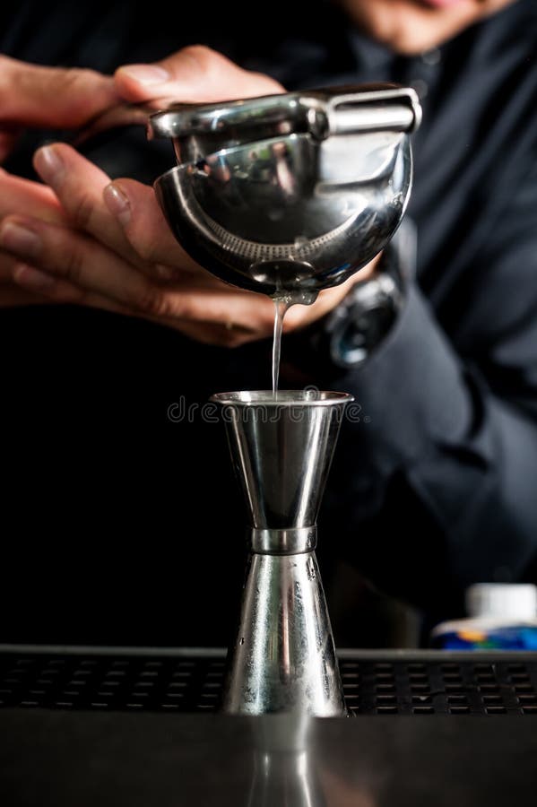 The Bartender Makes a Cocktail at the Bar. Macro Shooting with Drops ...