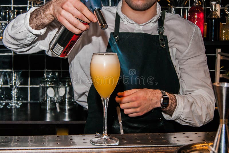 Bartender makes a cocktail stock image. Image of hand - 97348105