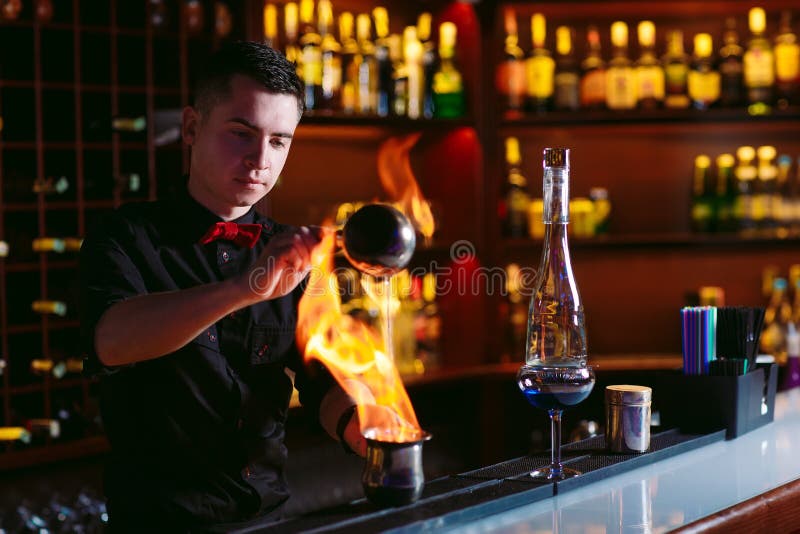 Bartender Makes Hot Cocktail in a Restaurant in the Bar. Stock Image ...