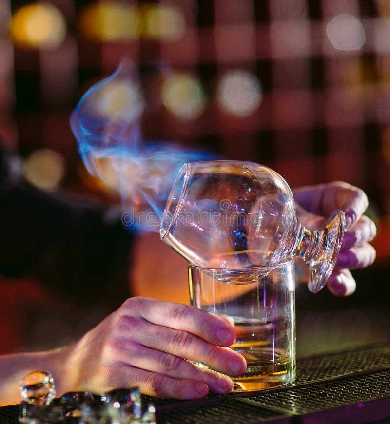 Bartender Makes Hot Cocktail in a Restaurant in the Bar. Stock Image ...