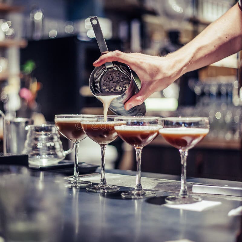 Bartender Making an Alcoholic Cocktail, a Summer Cocktail in the Bar ...