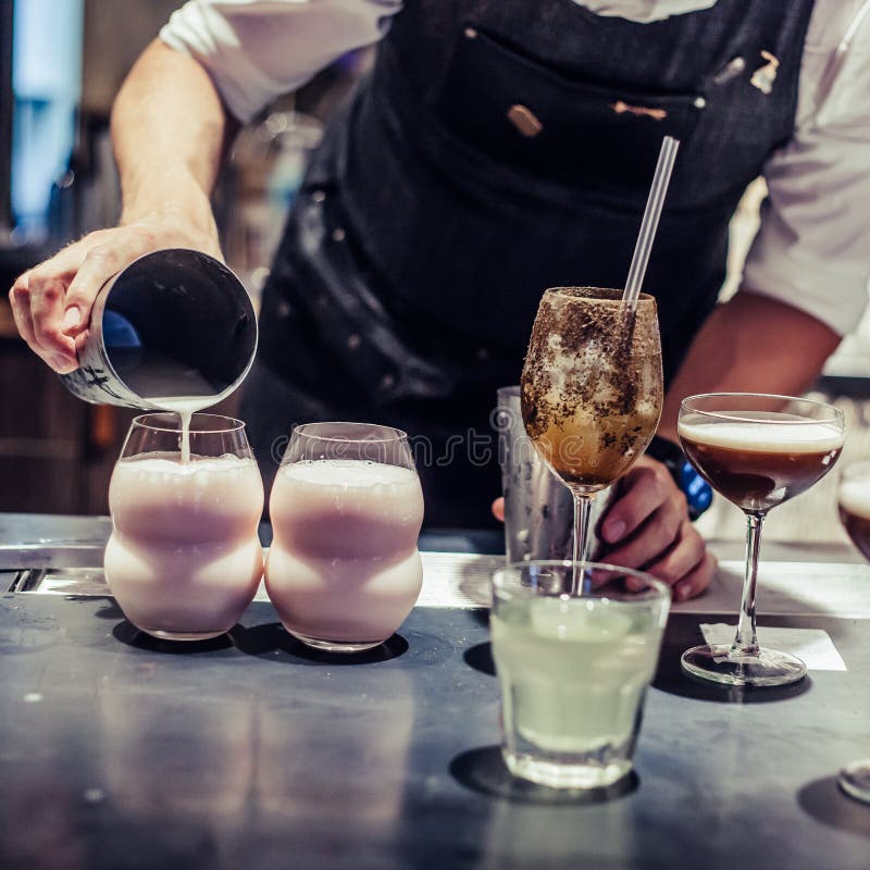 Bartender Making an Alcoholic Cocktail, a Summer Cocktail in the Bar ...