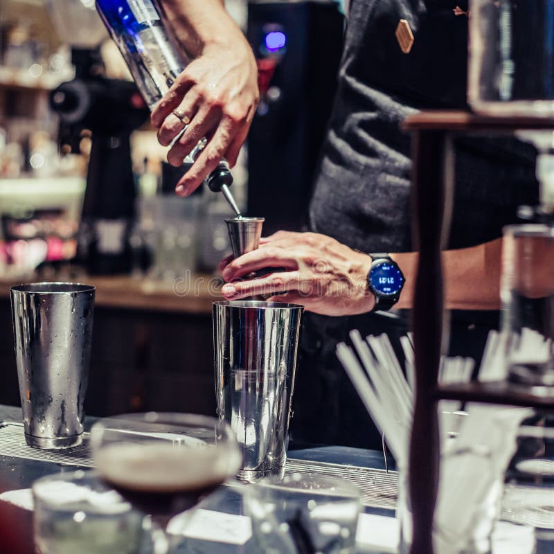 Bartender Making an Alcoholic Cocktail, a Summer Cocktail in the Bar ...